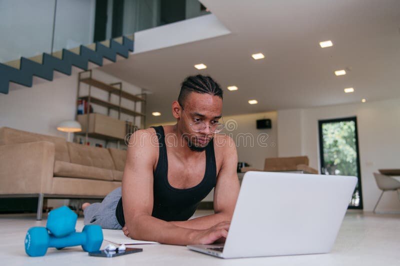 Training at Home. Sporty African American Man Doing the Training while ...