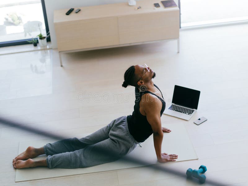 Training at Home. Sporty Man Doing the Training while Watching an ...