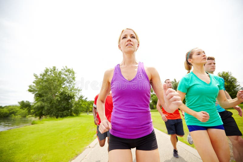 Training Outdoors. Front View of a Group of Runners on an Outdoor Track ...