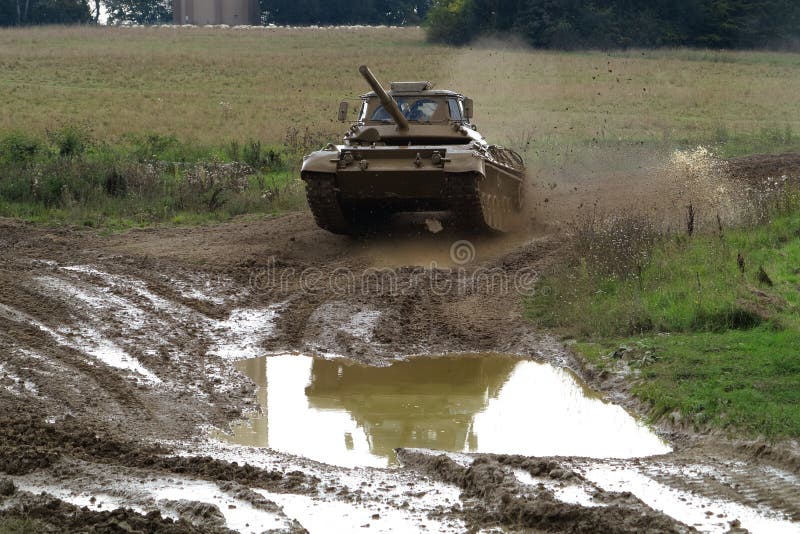 Training Tank Speeding into Muddy Puddle Stock Photo - Image of ...