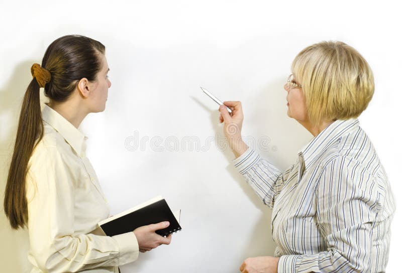 Training young employee, Experienced women teaches young