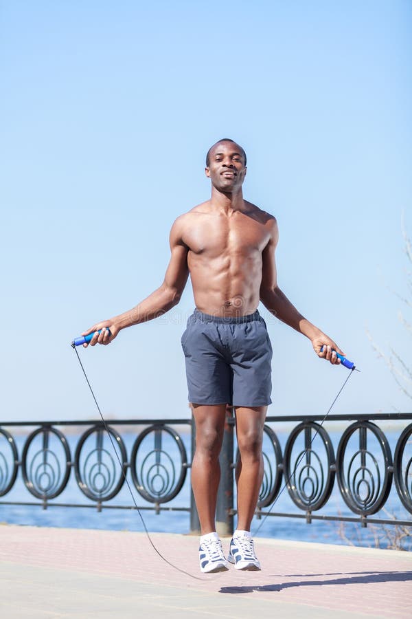 Trainings Everyday. Young African Decsent Men Jumping on the Rope Stock ...