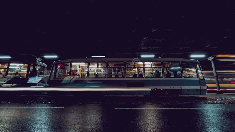 Tram at Night Under the Bridge Stock Image - Image of streaks ...