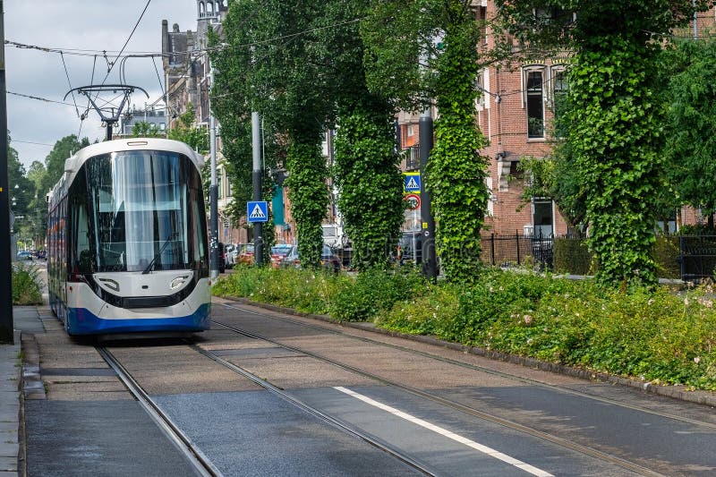 A Tram, a Public Transport Vehicle, in Motion on Rails Editorial Stock ...