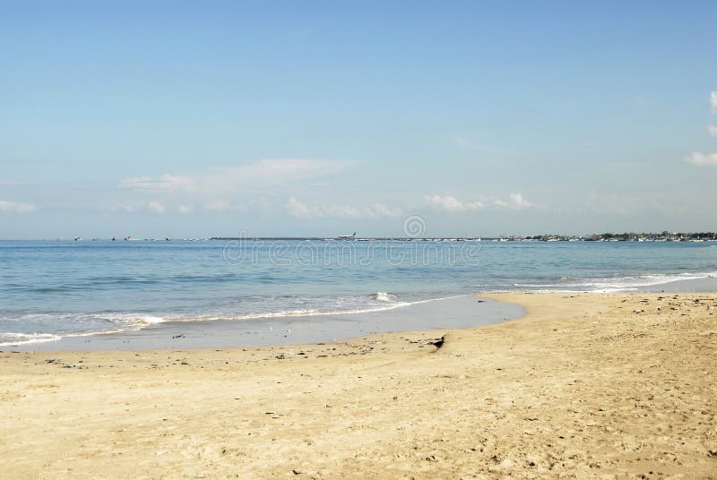 Tranquil Beach Scene in Bali with Clear Blue Water and Sandy Shore ...