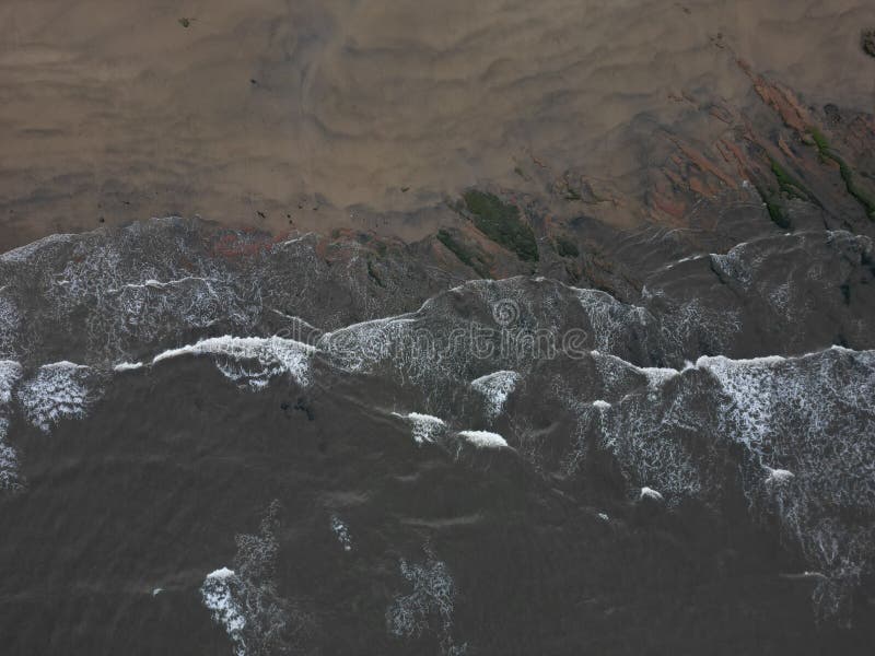 Tranquil Beach Scene Featuring Large Rolling Waves and Vast Stretches ...