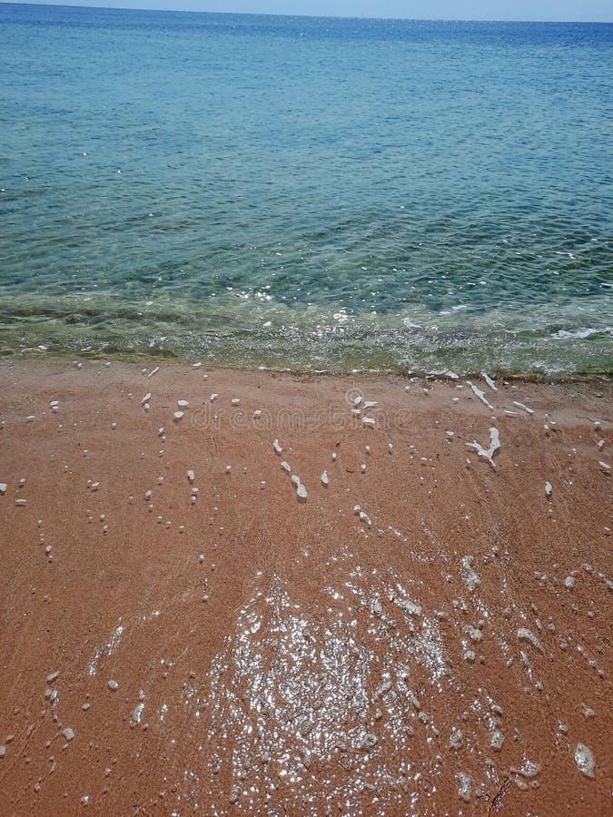 Tranquil Beach Scene with Gentle Waves Washing Over Sandy Shoreline ...