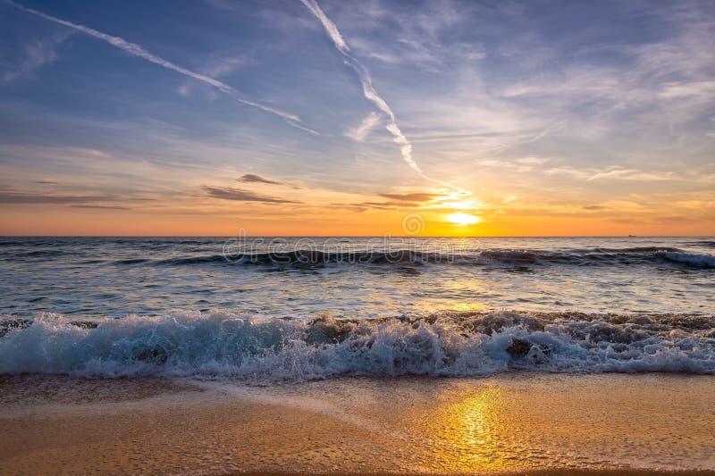 Beachscape at sunset stock image. Image of tracks, outcrop - 11339089