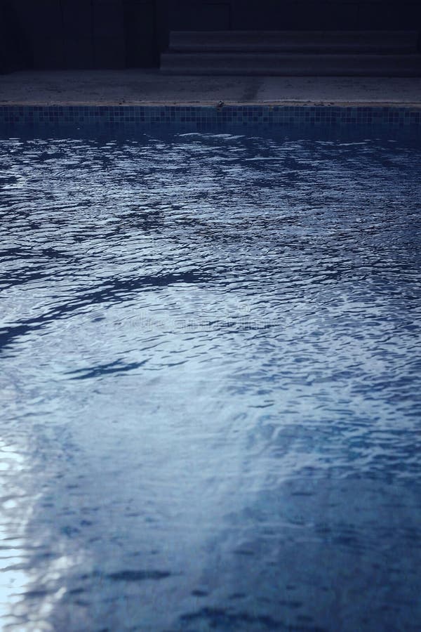 Tranquil blue pool water stock photo. Image of reflection - 273574608