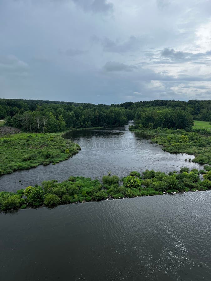 Tranquil Body of Water Surrounded by Lush Greenery Stock Photo - Image ...