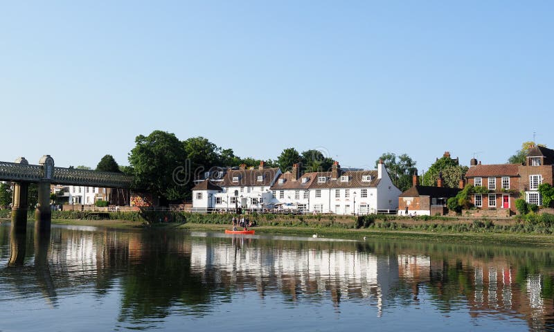 Tranquil Evening Scene on the River Thames with a Red Canoe Passing a ...