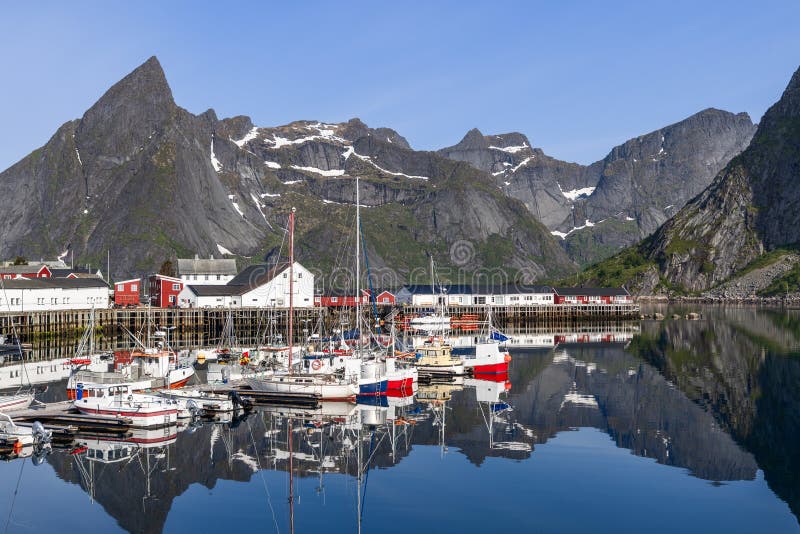 Hamnoy S Harbor, Encircled by Cliffs, Reflects Boats and Norwegian ...