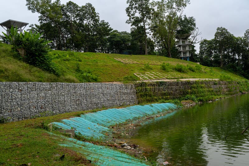 Serene Lakefront Landscape with Engineered Slope Protection Stock Photo ...