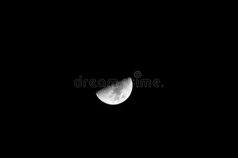 Tranquil Image Featuring a Half Moon Suspended Against a Night Sky ...