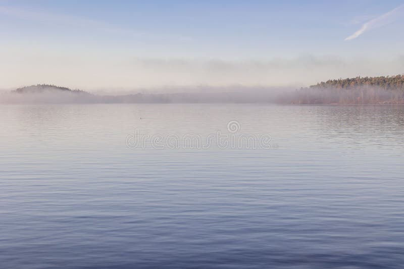 Tranquil Lake Covered in a Thin Layer of Fog. Stock Photo - Image of ...