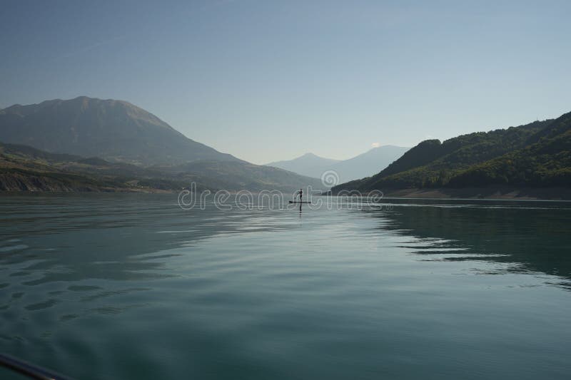 Tranquil Lake in a Mountains, Creating a Reflection of the Surrounding ...