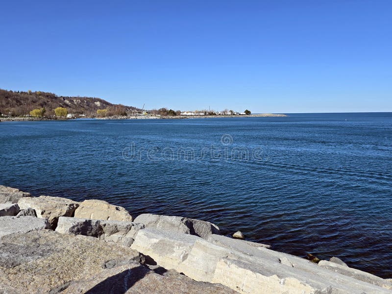 Rocky Shoreline Distant Hills Spring Trees Lake Stock Photos - Free ...