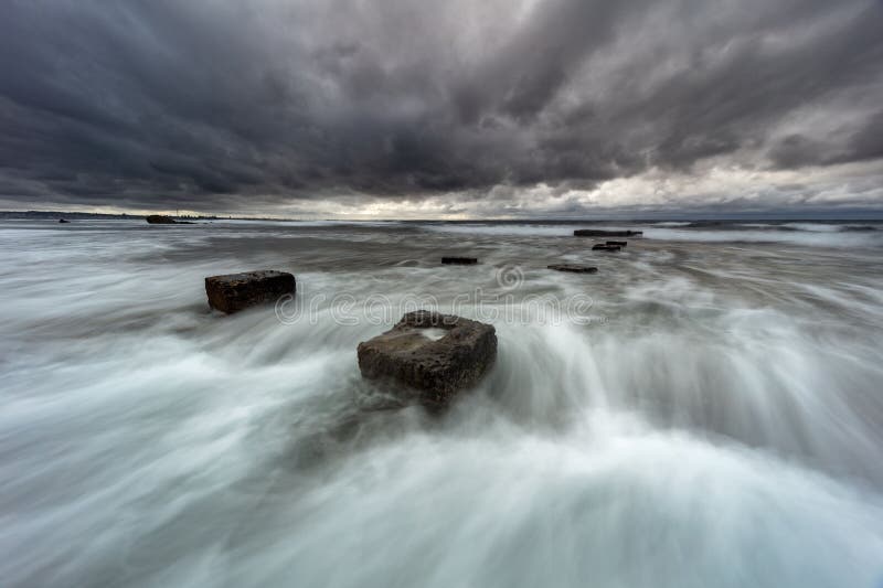 Tranquil Ocean Scene Featuring an Array of Rugged Rocks Jutting Out of ...