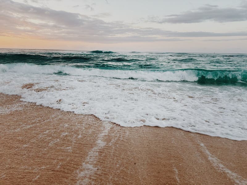 Tranquil Ocean Waves Washing Ashore at Sunset Stock Image - Image of ...