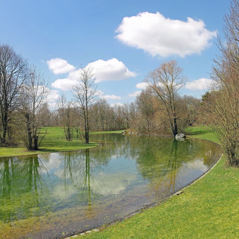 Tranquil Park Scenery with Reflecting Trees in the Pond Stock Image ...