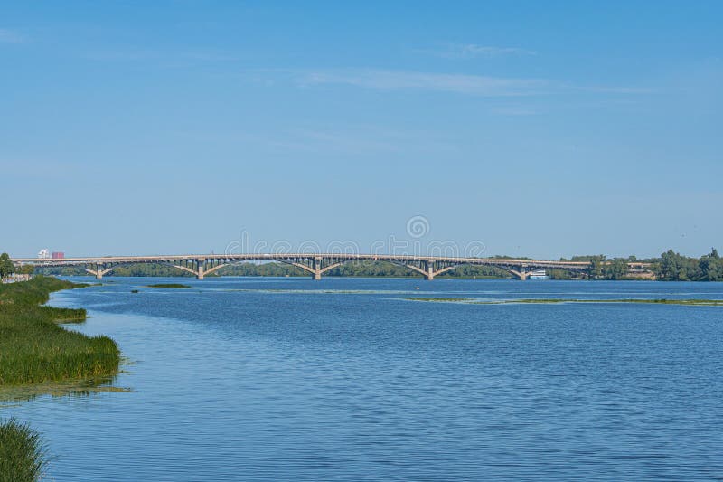 A Tranquil River Scene with Multiple Bridges, Under a Clear Blue Sky ...