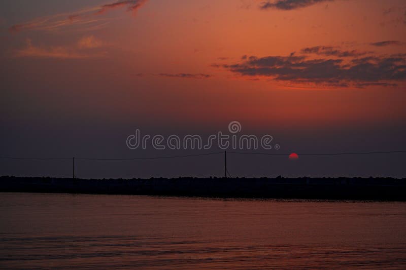 Tranquil Scene of a Breathtaking Sunset Reflecting on the Calm Body of ...