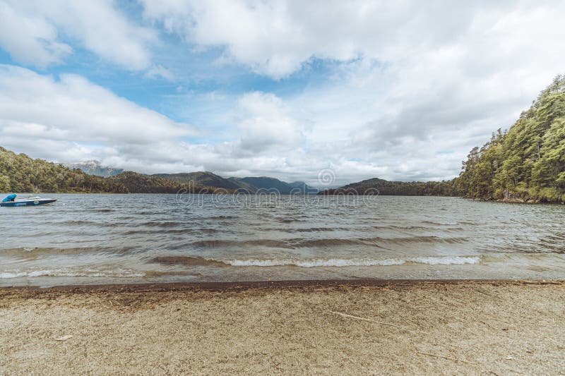 Tranquil Scene Featuring a Pond of Blue Water, Surrounded by Lush ...
