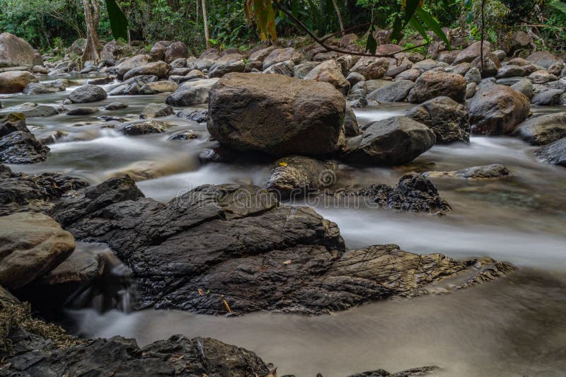 Tranquil Scene of Nature with a River Winding Its Way through Rocks ...