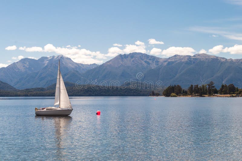 Tranquil Scene of a Sailboat on a Lake Stock Image - Image of ...