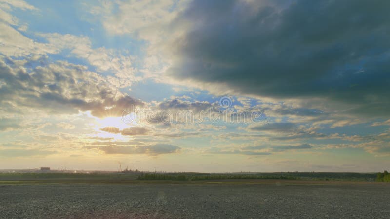 Tranquil Sunset Over Open Fields with Beautiful and Dramatic Clouds in ...