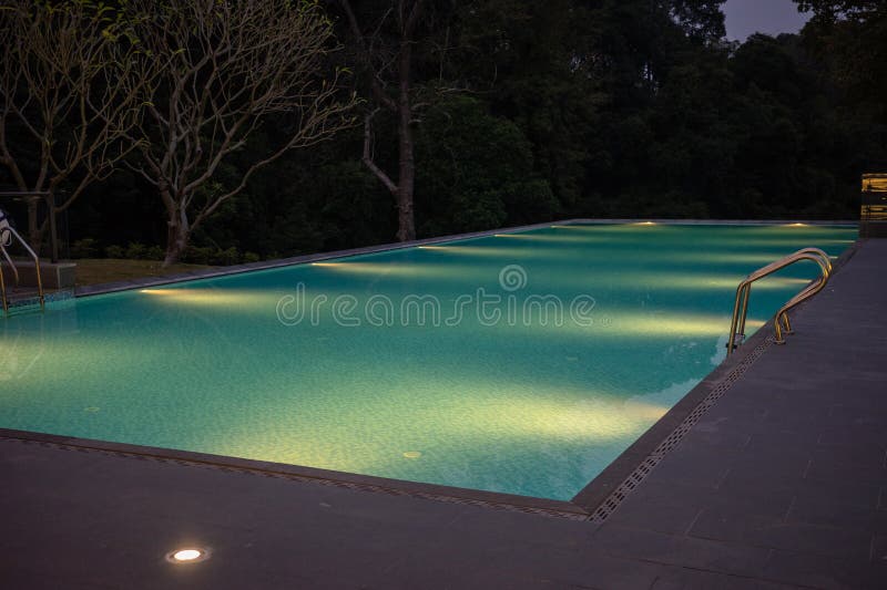 A Tranquil Swimming Pool in the Evening Stock Image - Image of pool ...