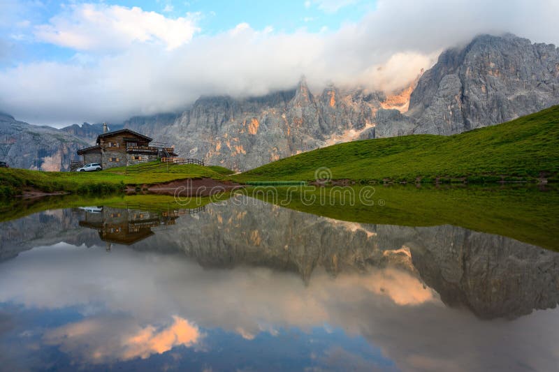 Tranquil View of a Lake Featuring a Small Building on the Lakeside ...