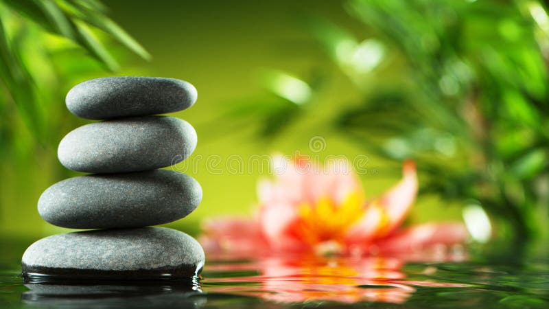 Tranquil Water Surface with Black Lava Stones Stock Image - Image of ...