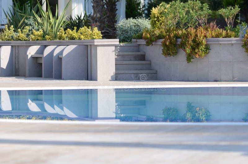 Tranquility by the Pool with a Nice Floral Garden. Stock Photo - Image ...