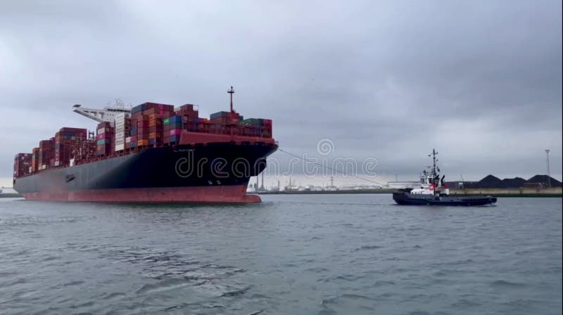 Transatlantic Container Ship Steered by a Guide Ship Entering a Seaport ...