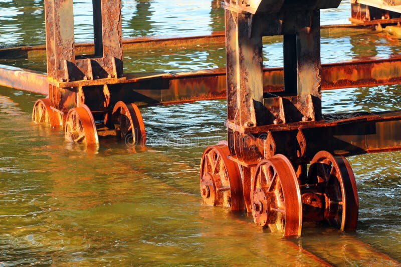 Transfer System of Shiplift at an Old Shipyard. Rusty Steel Wheels in ...
