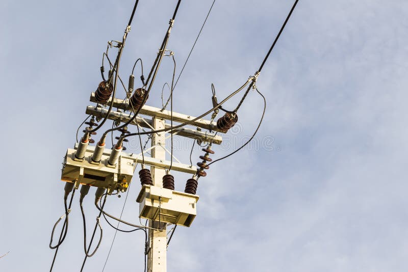 Transformers of an Electrical Post Against Twilight Blue Sky Background ...