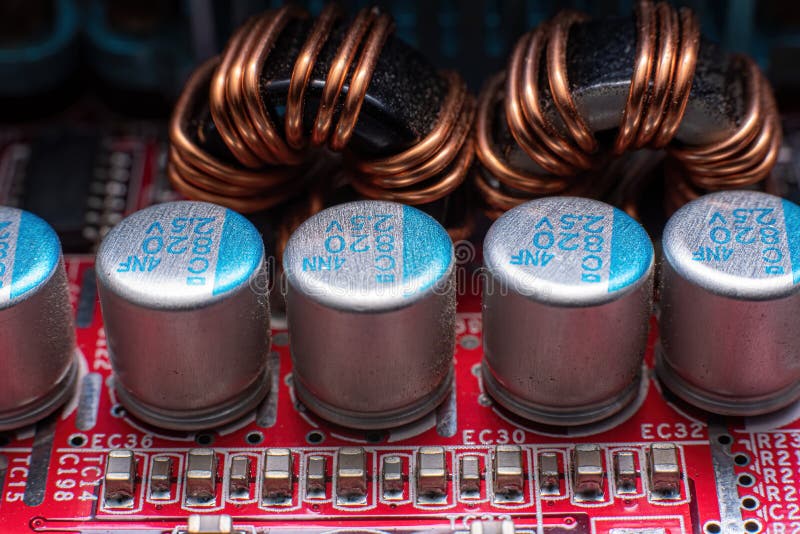 Transistors and Coils on a Red Motherboard Stock Image - Image of ...