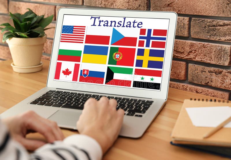 Translator Using Modern Laptop with Images of Different Flags on Screen ...
