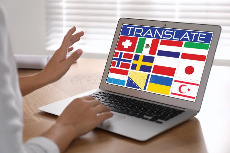 Translator Using Modern Laptop with Images of Different Flags on Screen ...
