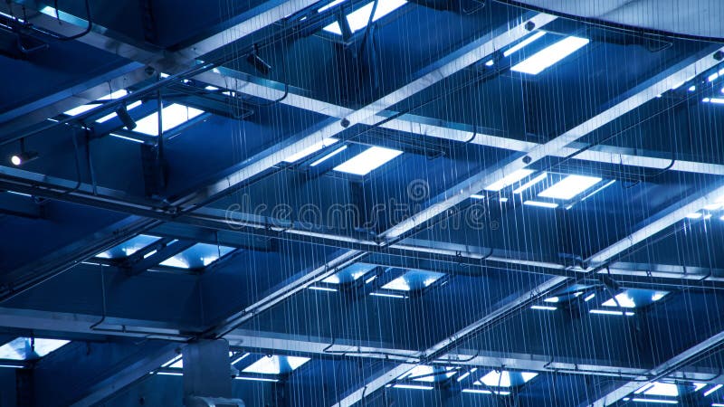 A Translucent Ceiling Made of Metal and Glass Square Cells that ...