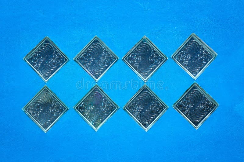 Translucent Glass on Blue Plaster Wall. Stock Photo - Image of glass ...