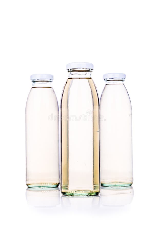 Translucent Liquid in Glass Bottle on White Background Stock Image ...