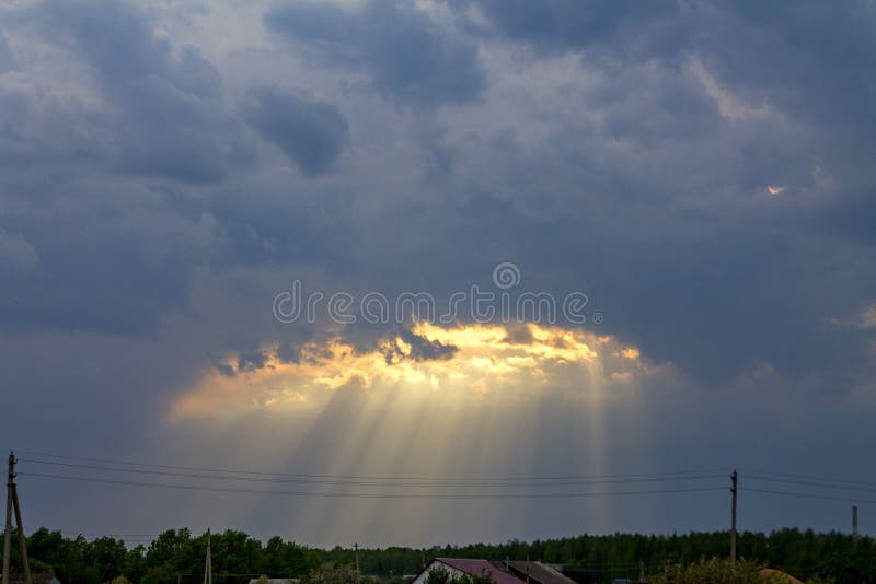 Translucent Rays of the Sun through the Blue Stormy Sky Stock Image ...