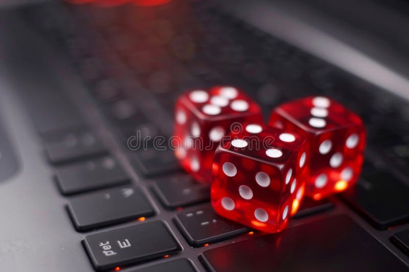 Translucent Red Dice on a Laptop Keyboard Emitting a Radiant Backlight ...