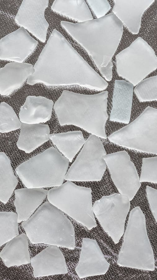Translucent White Stones on a Silver Metallic Background Stock Photo ...