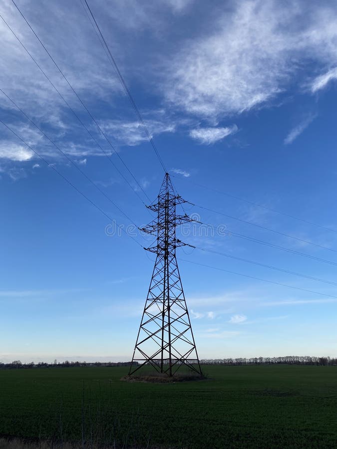 Transmission Tower in the Green Field Under Blue Sky Stock Photo ...