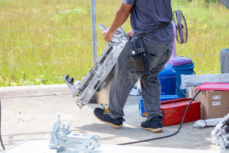 Transmitter Big Machine in the Hand of an Electrical Engineer. Machine ...