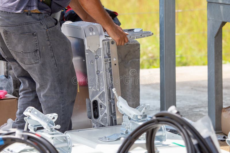 Transmitter Big Machine in the Hand of an Electrical Engineer. Machine ...
