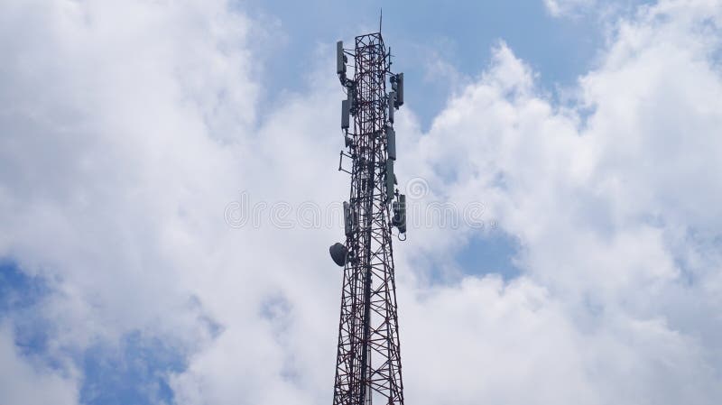 Transmitter Tower with Blue Sky and Clouds Background Stock Photo ...